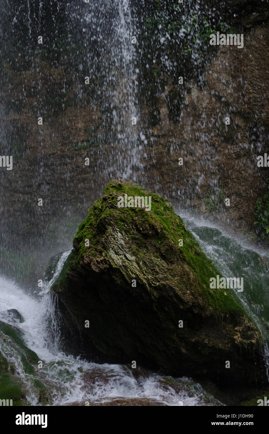 Waterfall dropping water drops on top of the rock Stock Photo - Alamy
