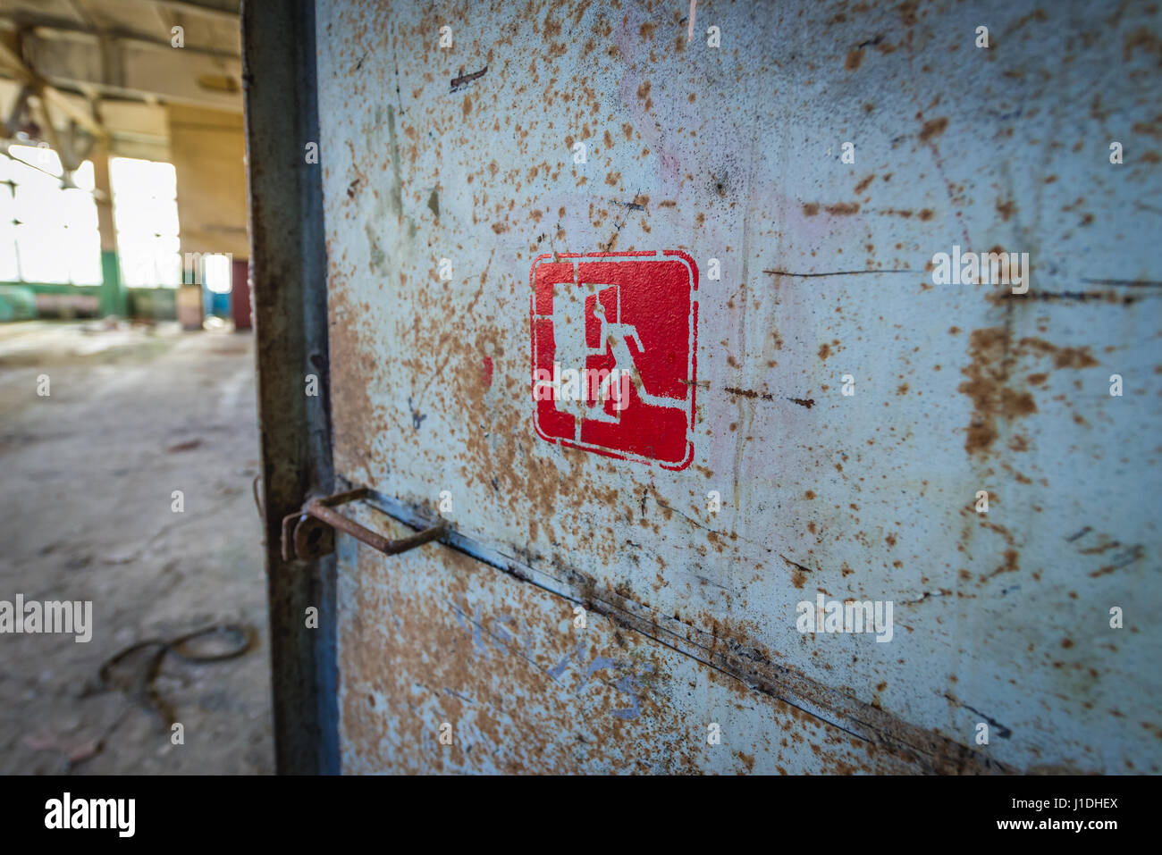 Emergency exit sign in abandoned Jupiter Factory in Pripyat ghost town ...