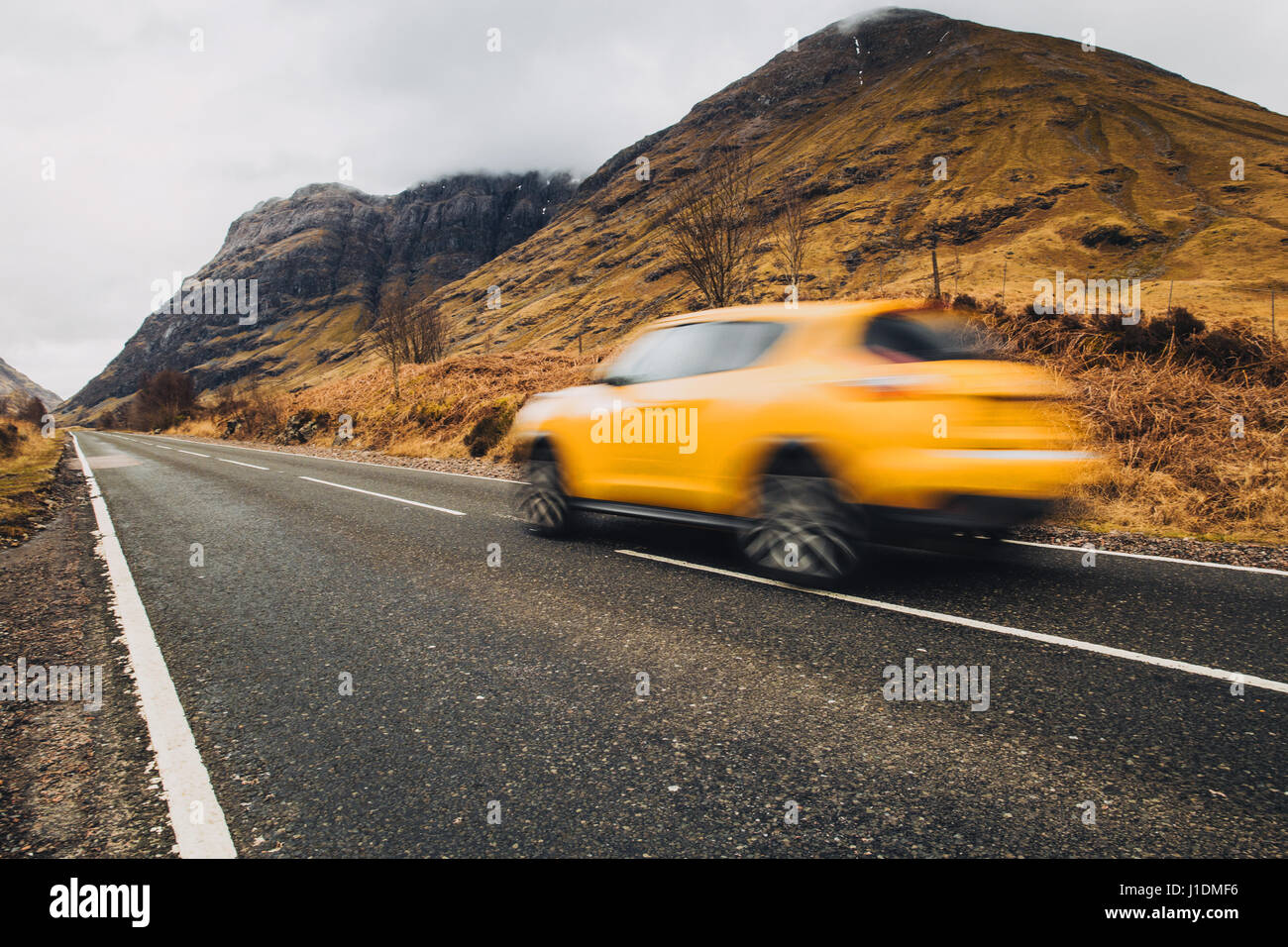 Car driving through Glencoe, Scotland. Scottish Highlands Stock Photo ...