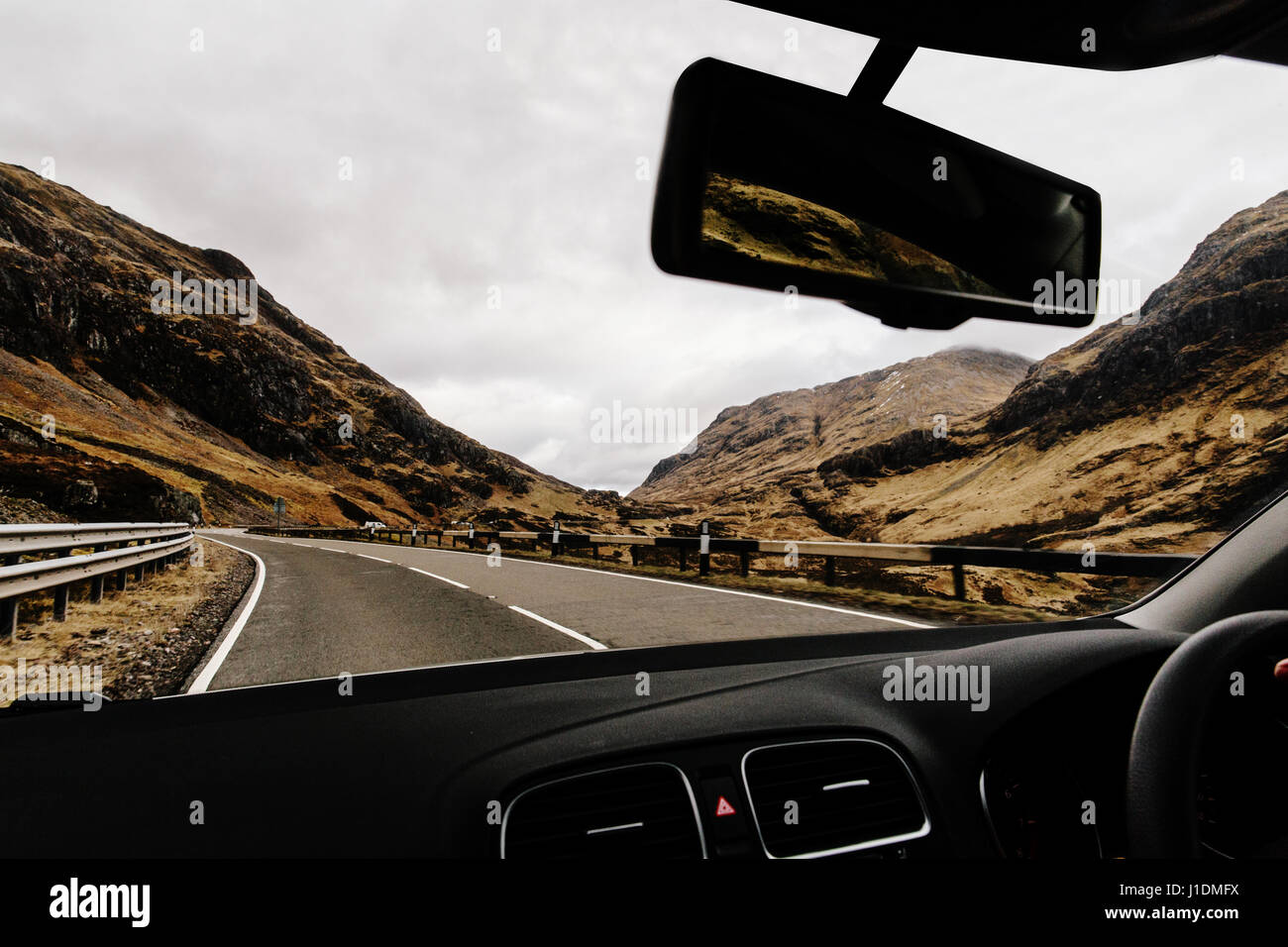 Car driving through Glencoe, Scotland. Scottish Highlands Stock Photo ...