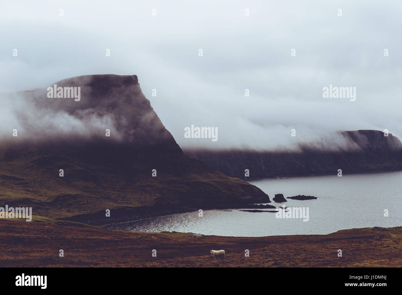 Misty cloud on coast of Isle of Skye Scotland Stock Photo - Alamy