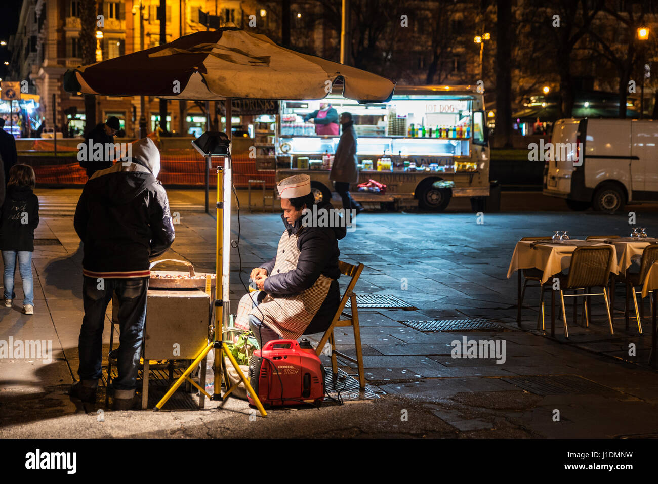 Rome, Italy - January 4, 2017: Street vendor of chestnuts at night in ...