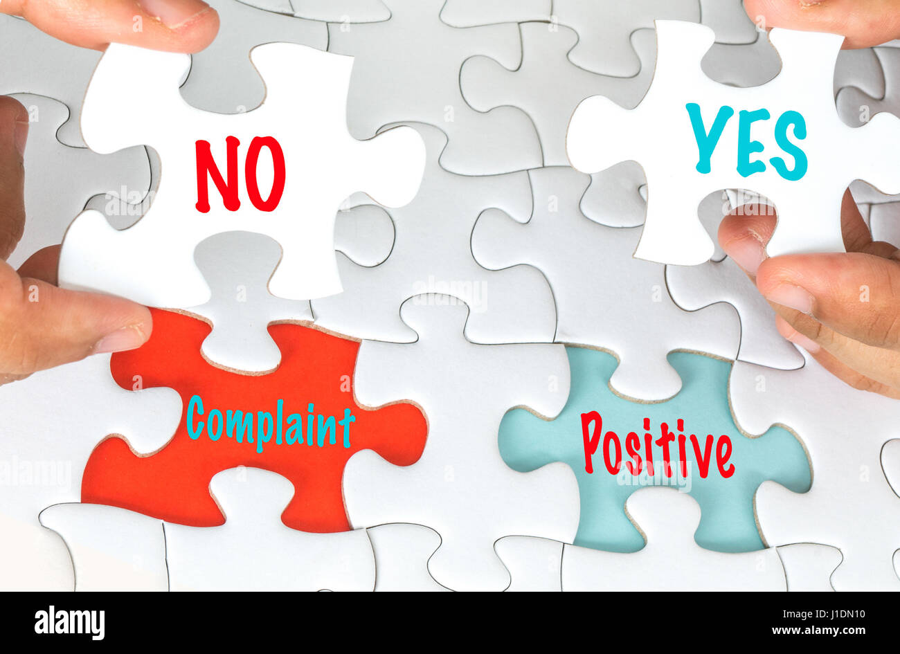 Hand holding jigsaw pieces yes and no. Proactive concept Stock Photo ...
