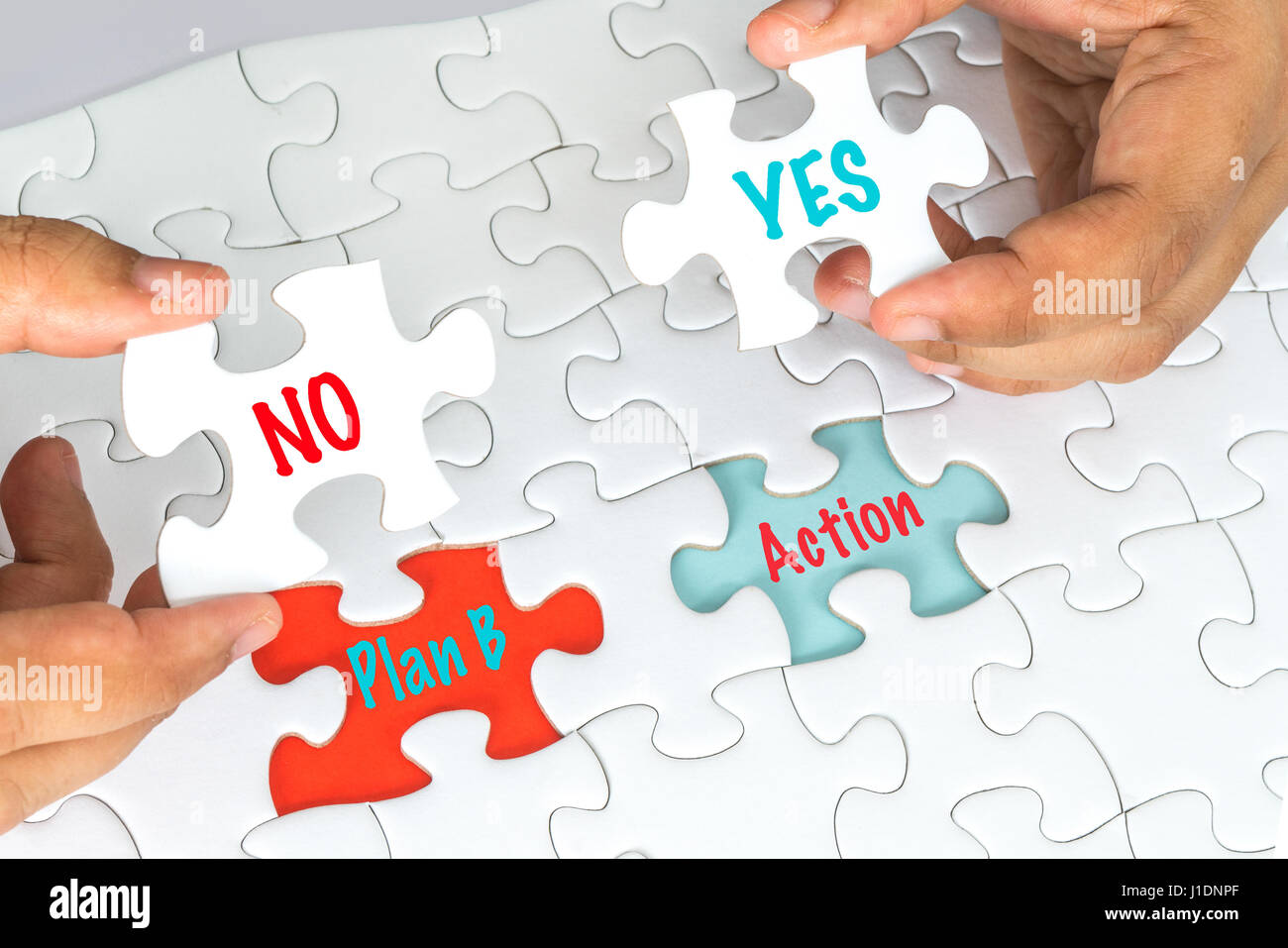 Hand holding jigsaw pieces yes and no. Proactive concept Stock Photo ...