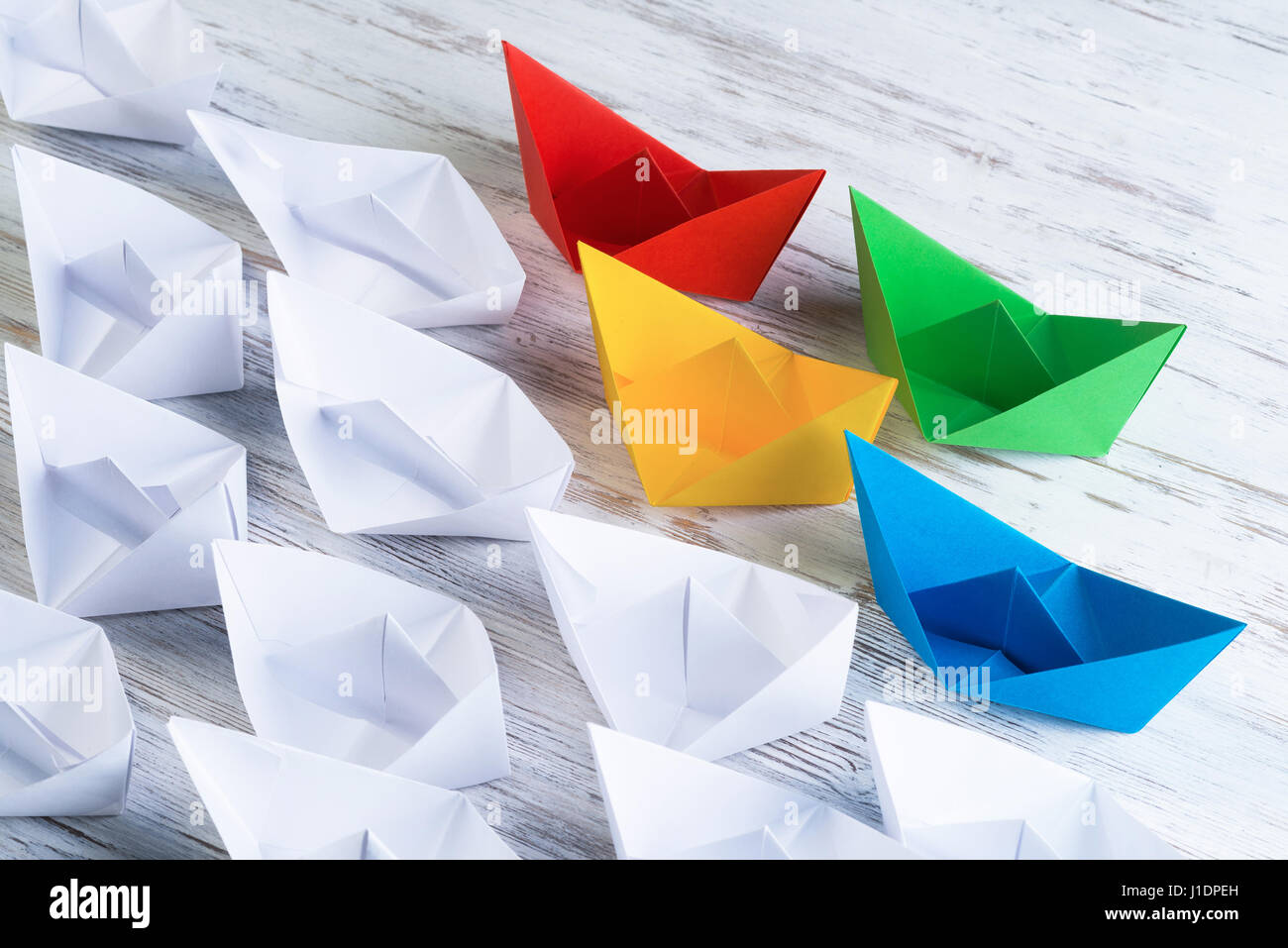 Business leadership concept with white and color paper boats on Stock ...