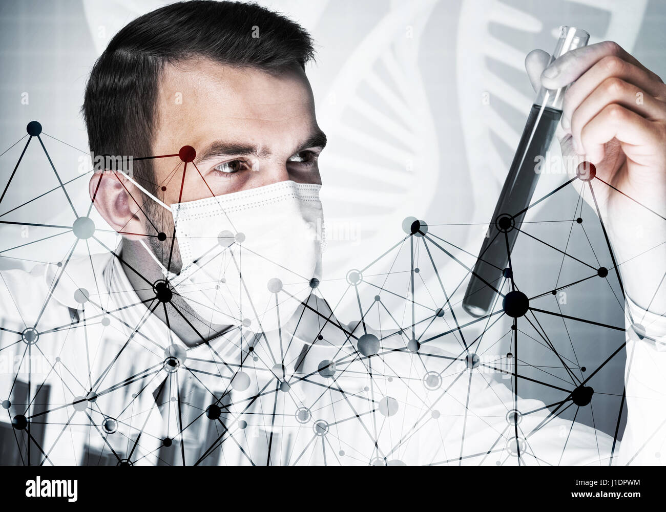 Portrait of concentrated male scientist working with reagents in ...