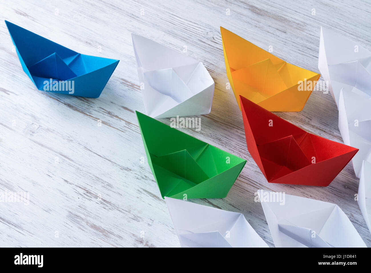Business leadership concept with white and color paper boats on Stock ...