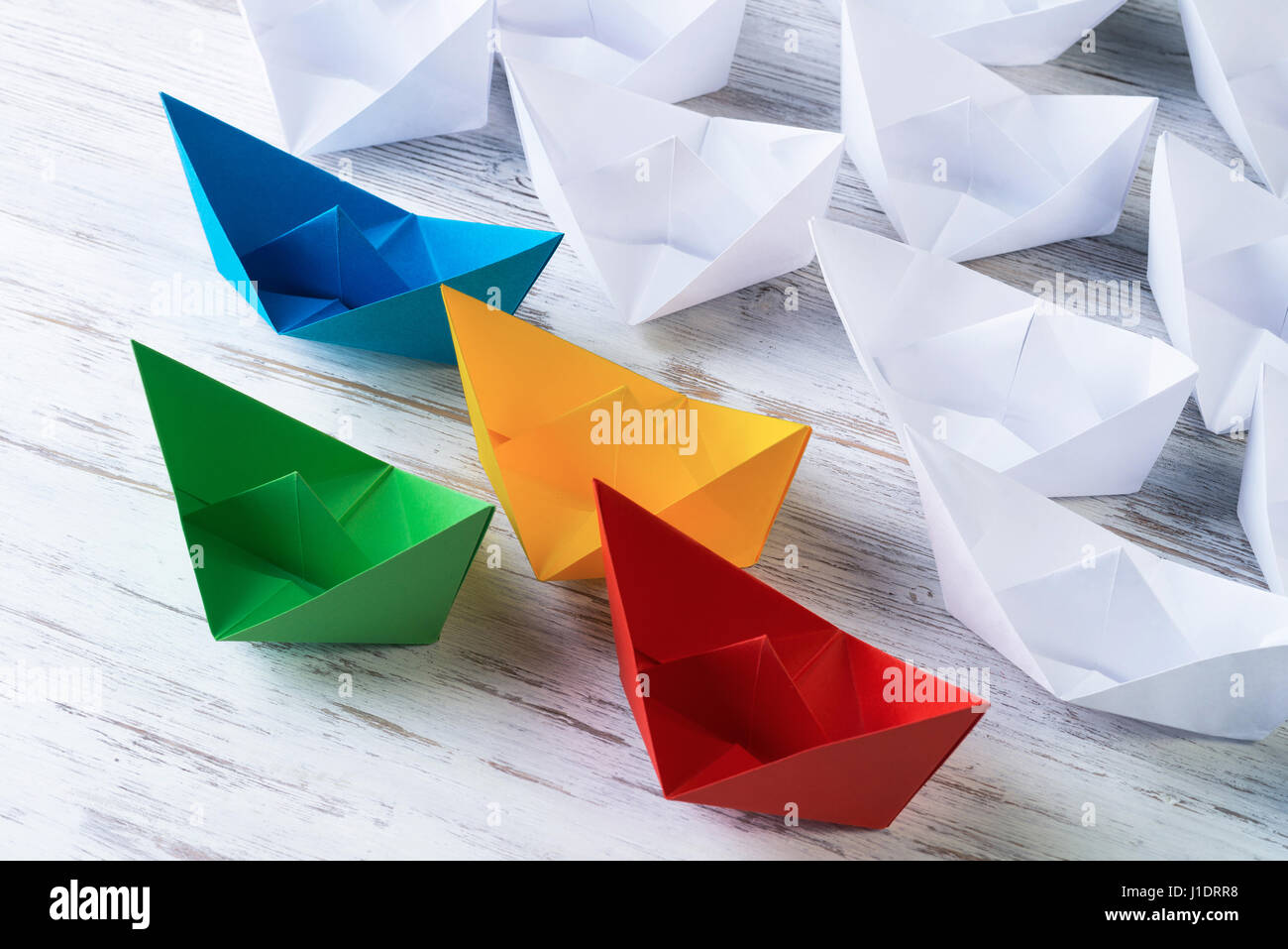 Business leadership concept with white and color paper boats on Stock ...