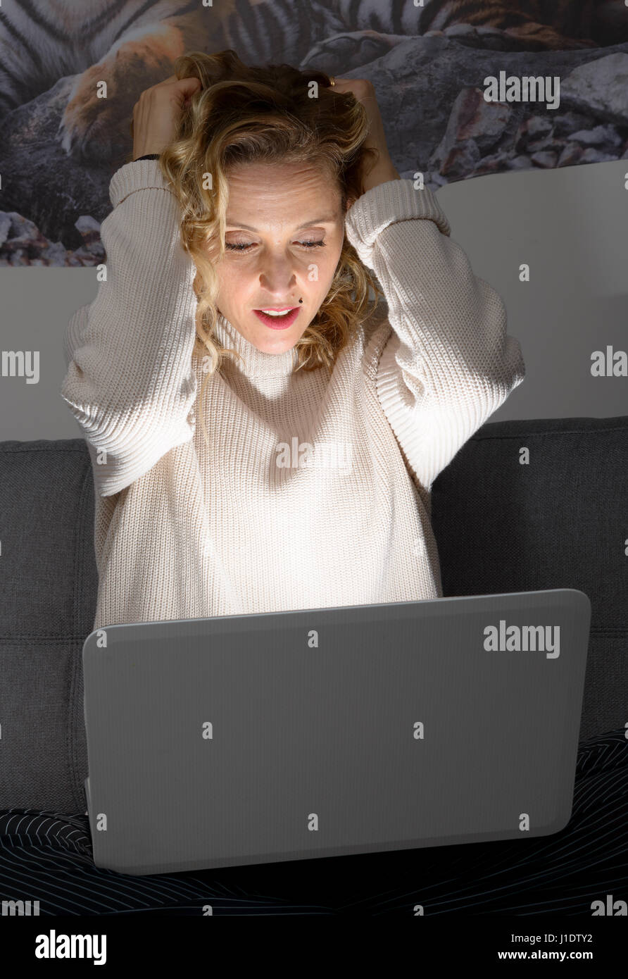 a woman at work with computer suffering painful headache Stock Photo ...