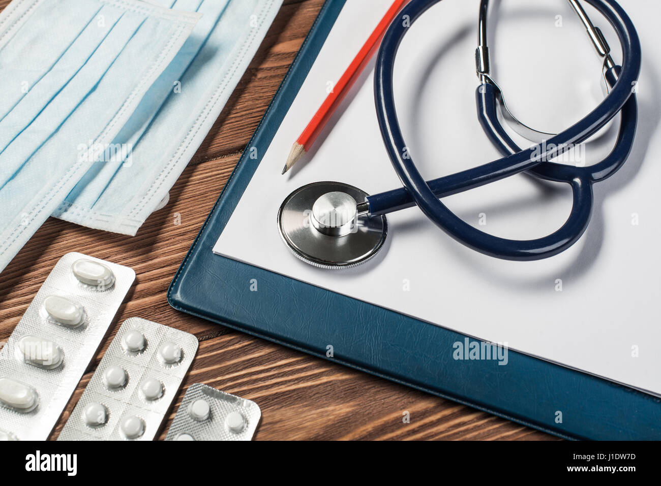 Desk of doctor with medicine things Stock Photo - Alamy