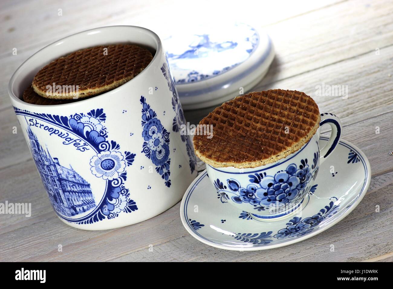 traditional Dutch syrup waffles with Delftware on wooden background ...