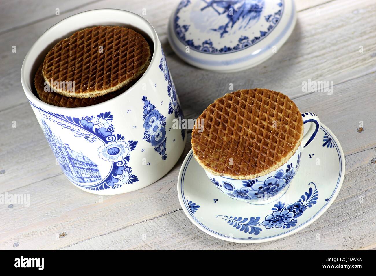 traditional Dutch syrup waffles with Delftware on wooden background ...
