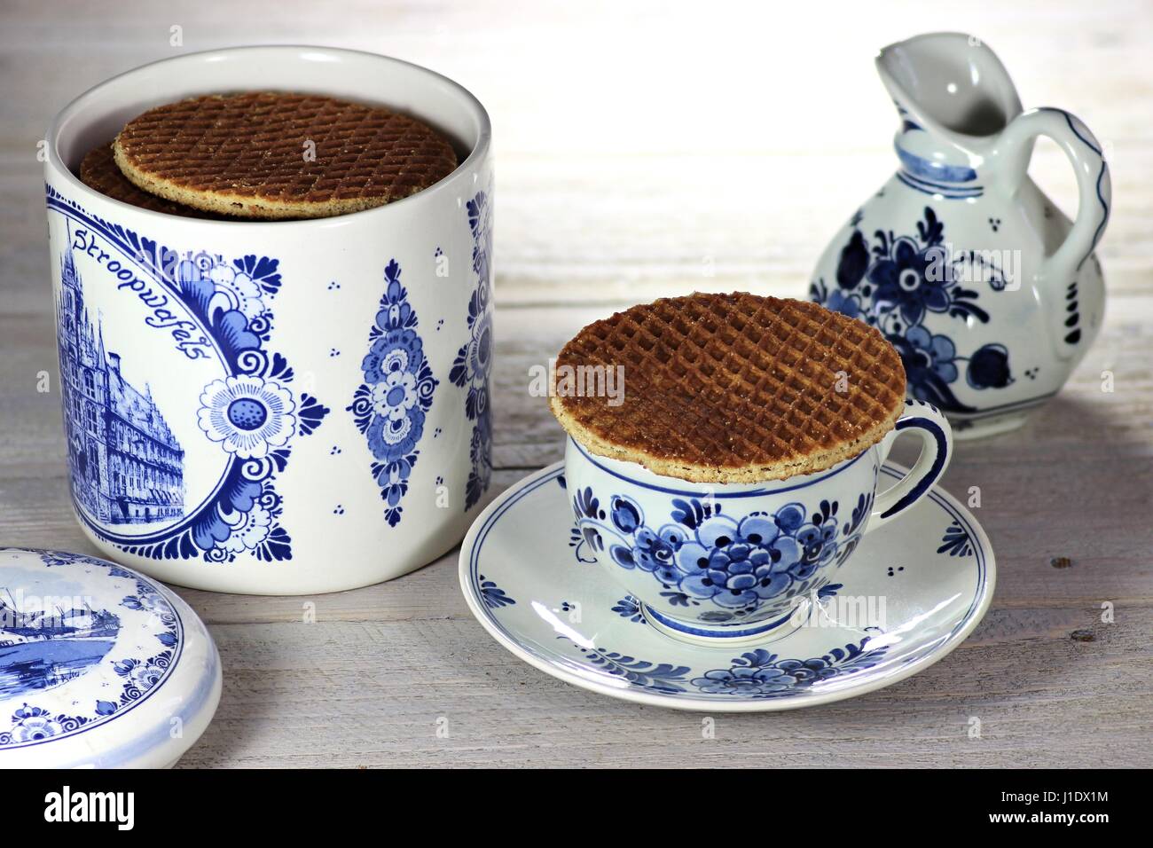 traditional Dutch syrup waffles with Delftware on wooden background ...