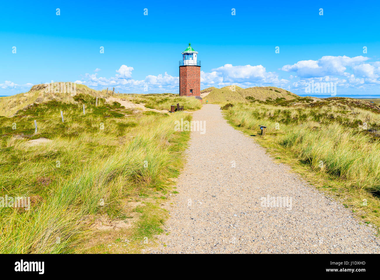 Lighthouse on green field in countryside landscape of Sylt island ...
