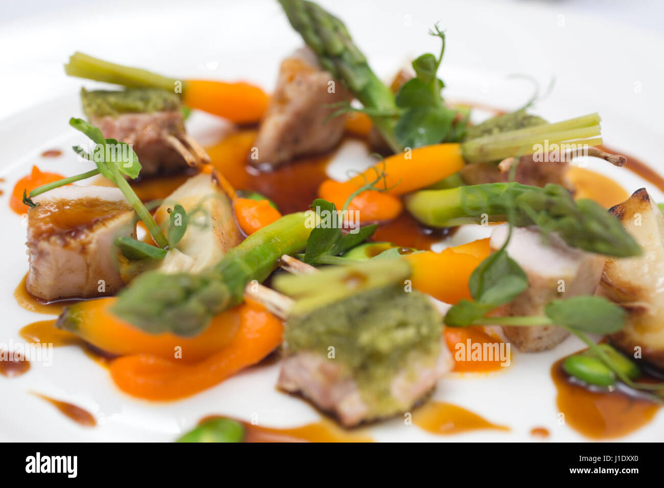 Loin of rabbit, carrot puree, asparagus, broad beans and cep mushrooms ...