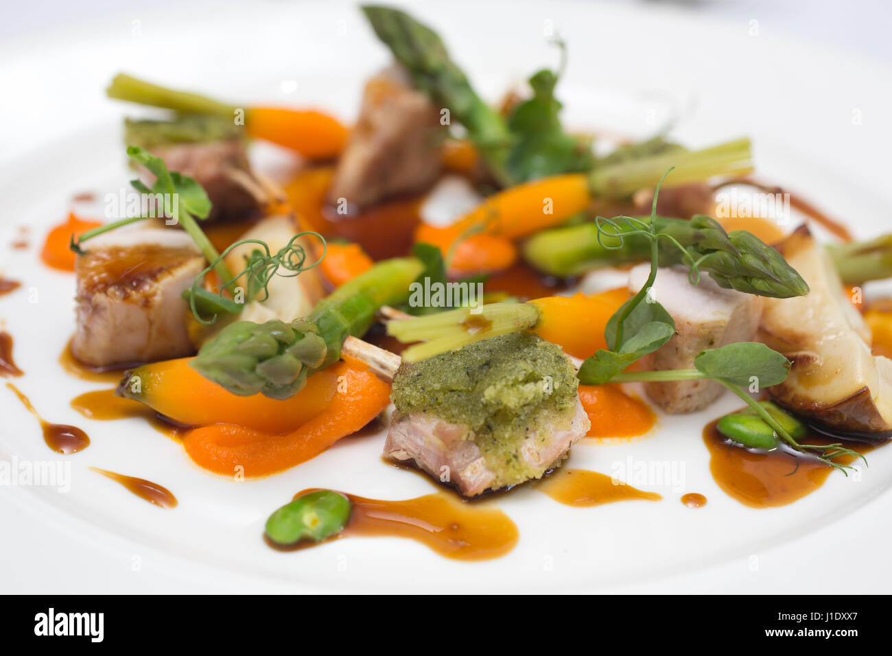 Loin of rabbit, carrot puree, asparagus, broad beans and cep mushrooms ...