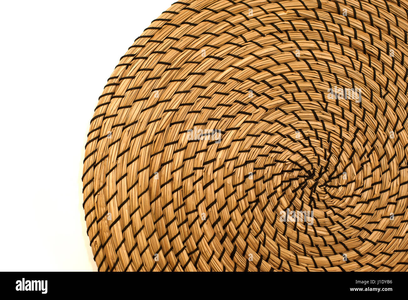 Round straw disc as a stand Stock Photo - Alamy