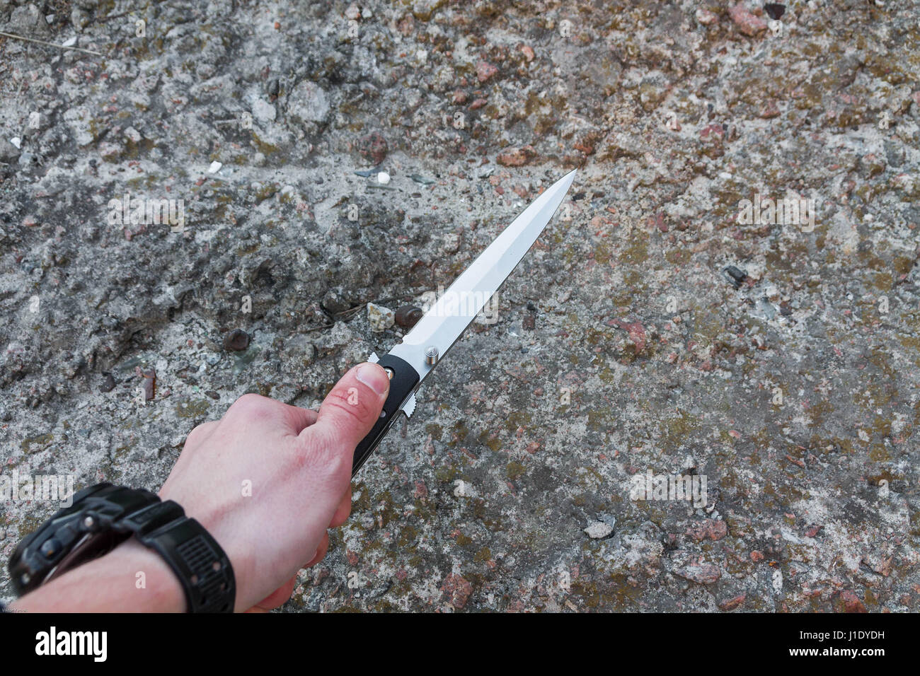 Large knife of the human hand. Danger. Attacking. Attack Stock Photo ...