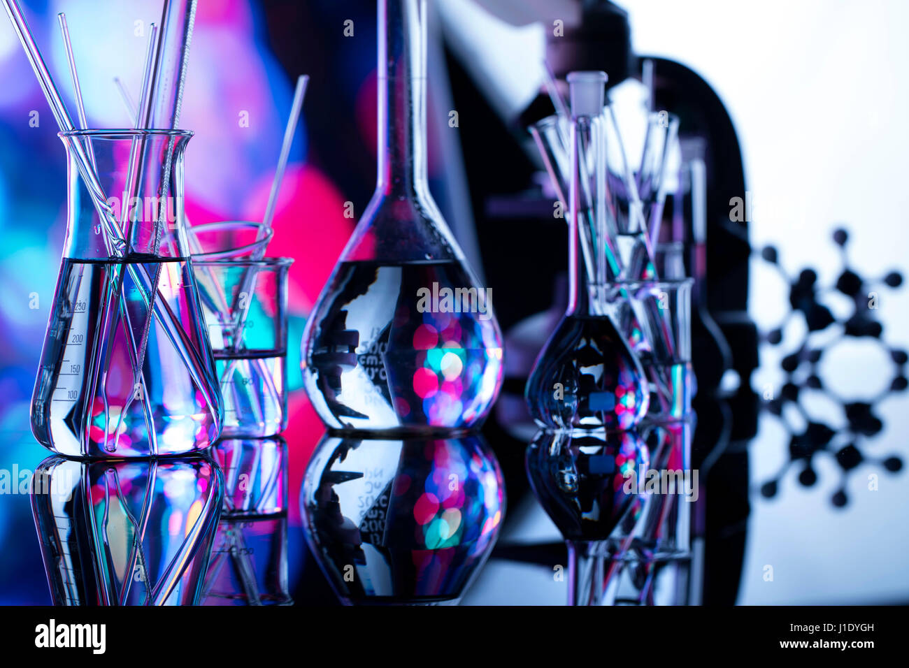 Modern laboratory equipment , set of different glassware on blue ...