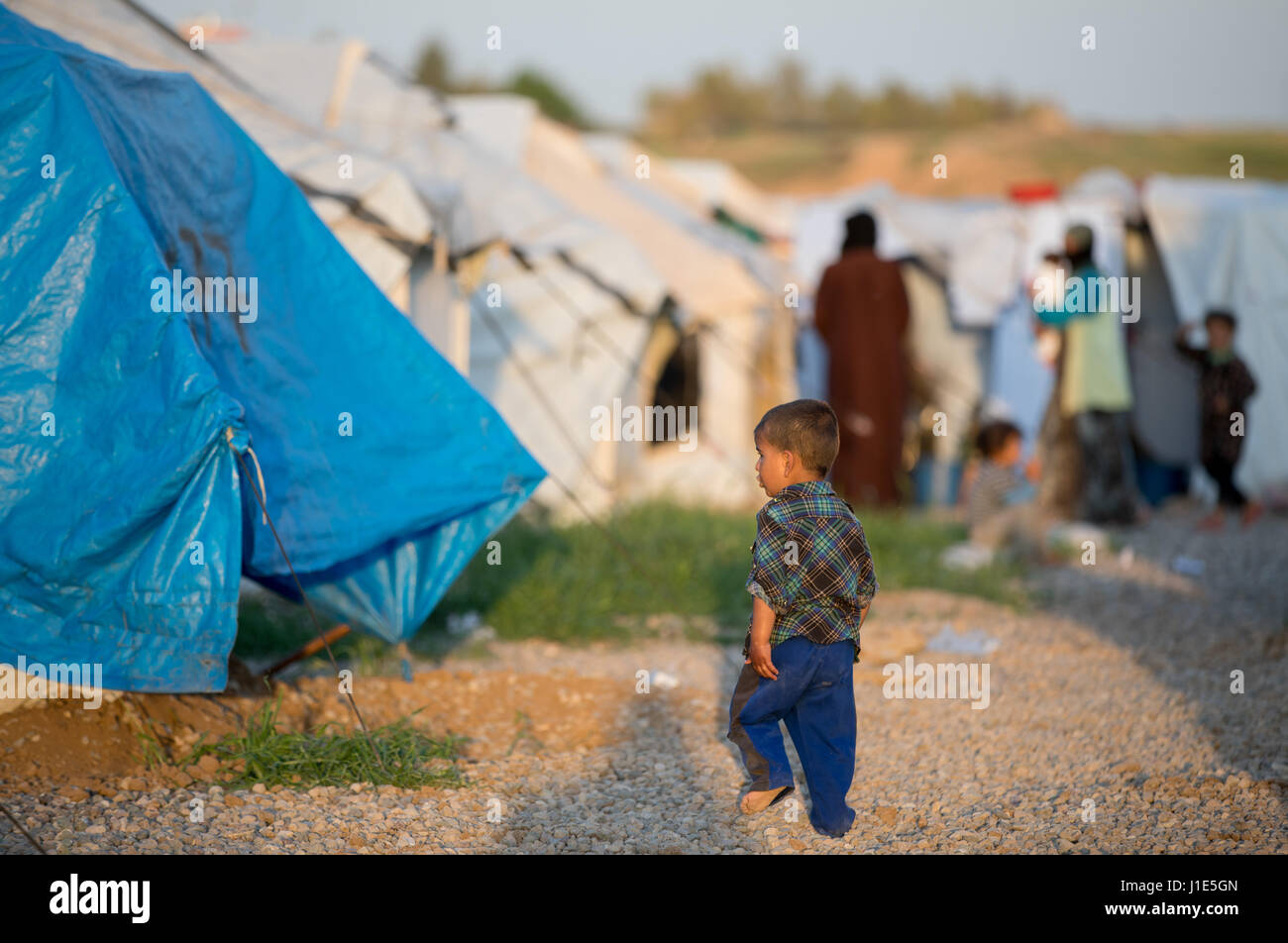 Bashiqa, Iraq. 20th Apr, 2017. A refugee child walks through the ...