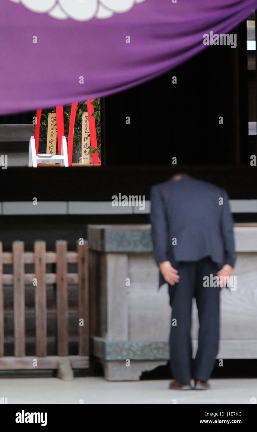 Tokyo, Japan. 21st Apr, 2017. A sacred branch with red ribbons ...