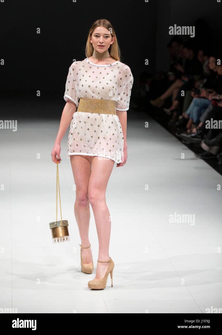 Toronto, Canada. 20th Apr, 2017. A model presents a creation by Ali ...