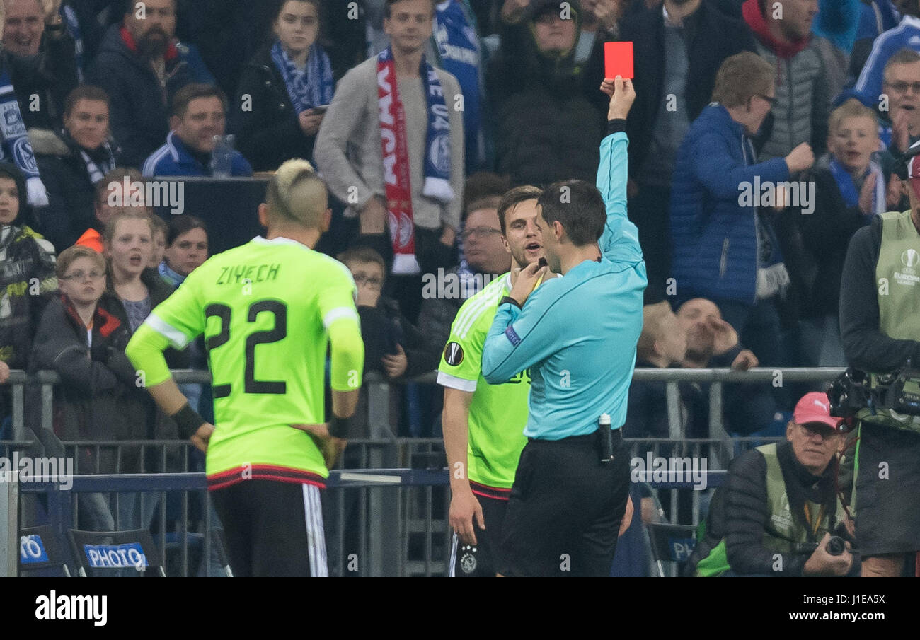 Referee Ovidiu Hategan shows Ajax's Joel Veltman (c) the red card ...