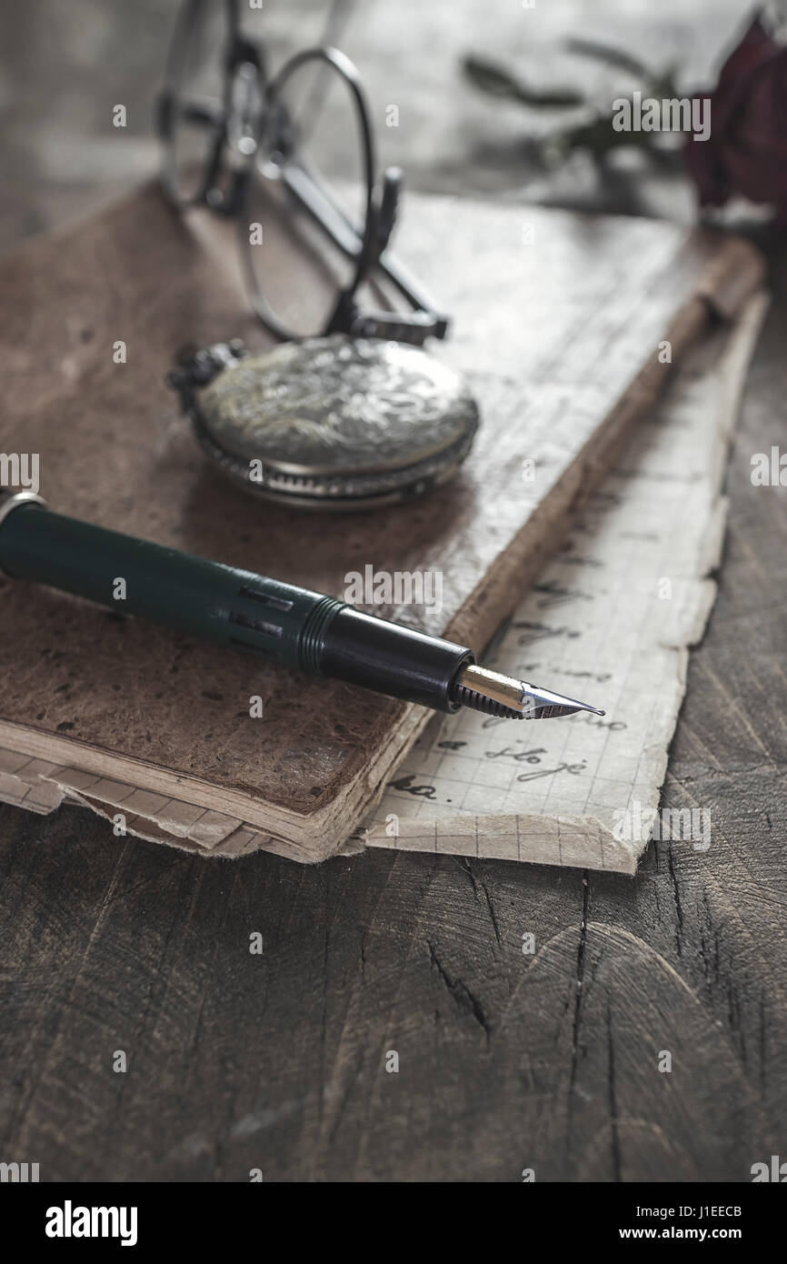 Old vintage diary book on wooden table. Toned photo Stock Photo - Alamy
