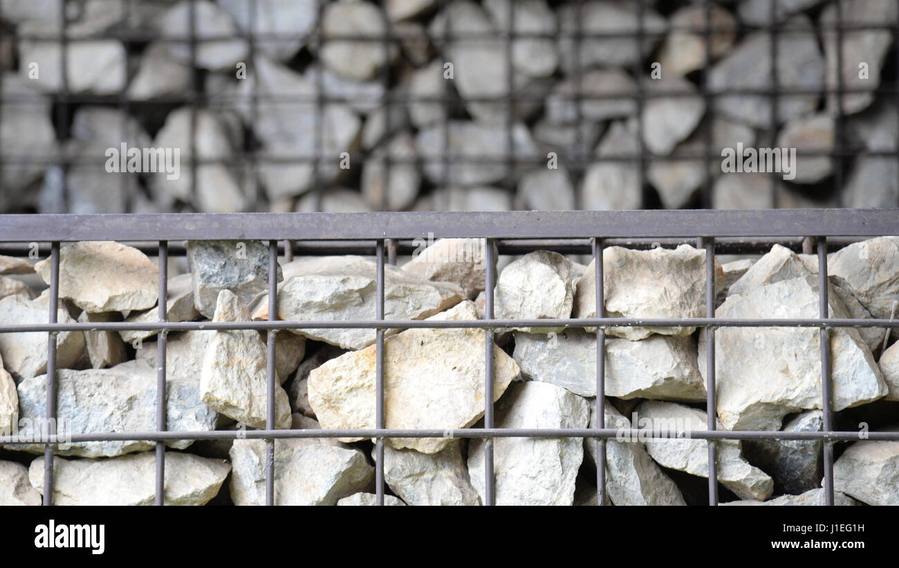 Stone wall with iron net texture background detail Stock Photo - Alamy