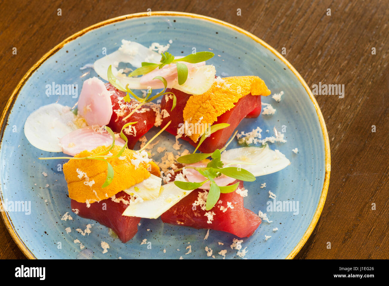 uni over raw ahi tuna Stock Photo - Alamy