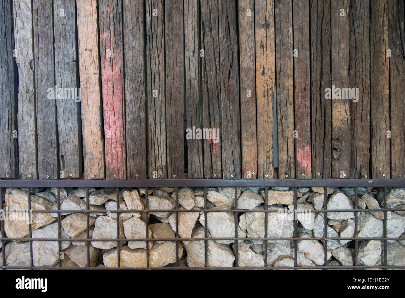 Old brown wood and stone in iron net wall texture background pattern ...