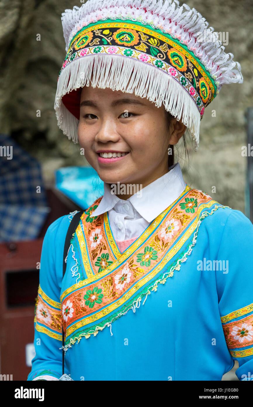 China, Guizhou, Dragon Palace Scenic Area. Young Woman in Traditional ...