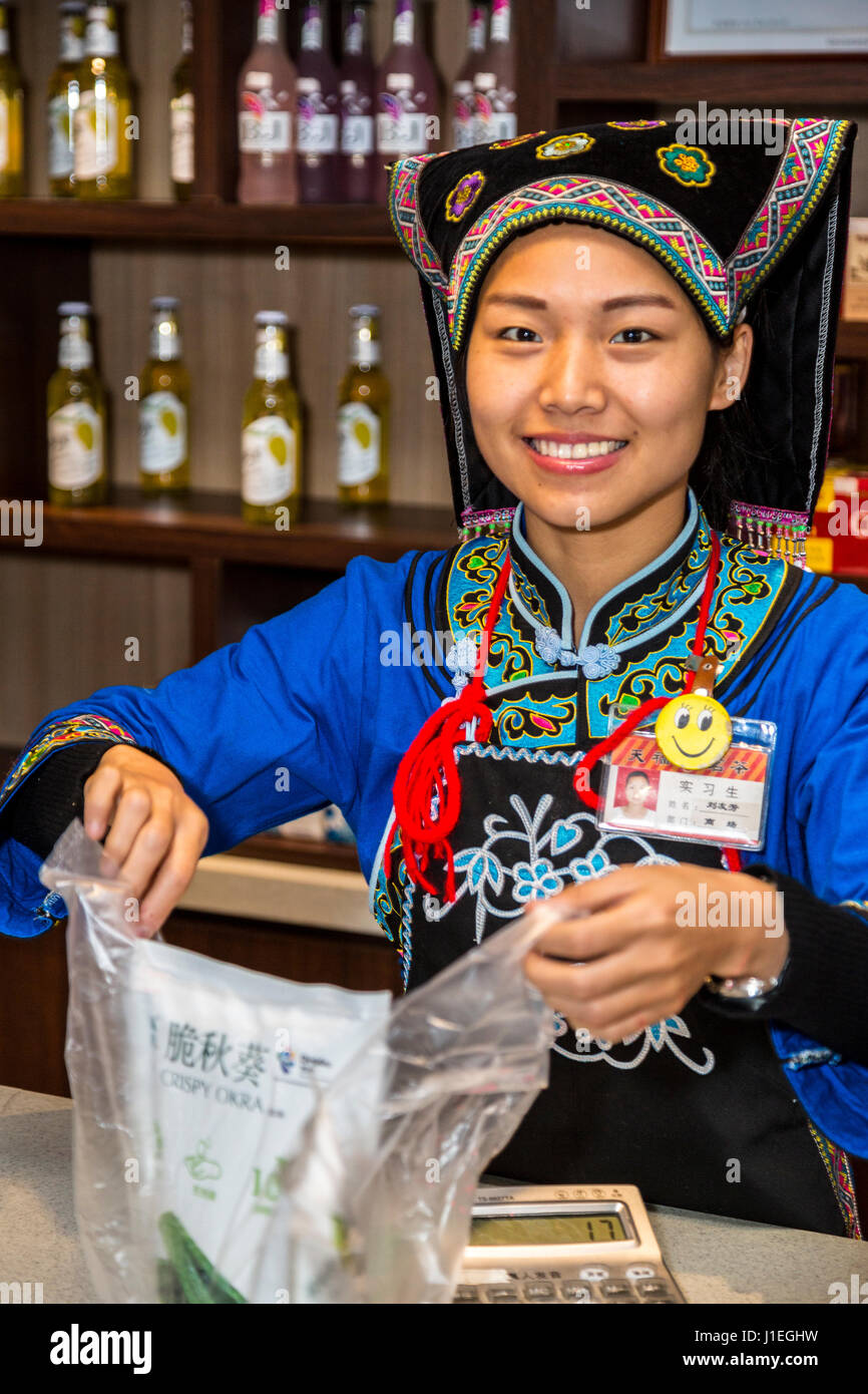 Guizhou, China. Young Han Chinese Woman in Bouyei Dress, working in a ...