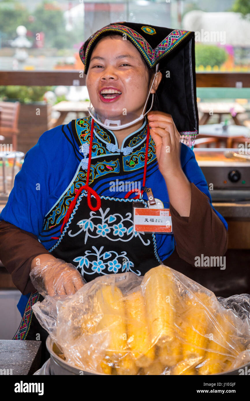 Guizhou, China. Young Han Chinese Woman in Bouyei Dress, working in a ...