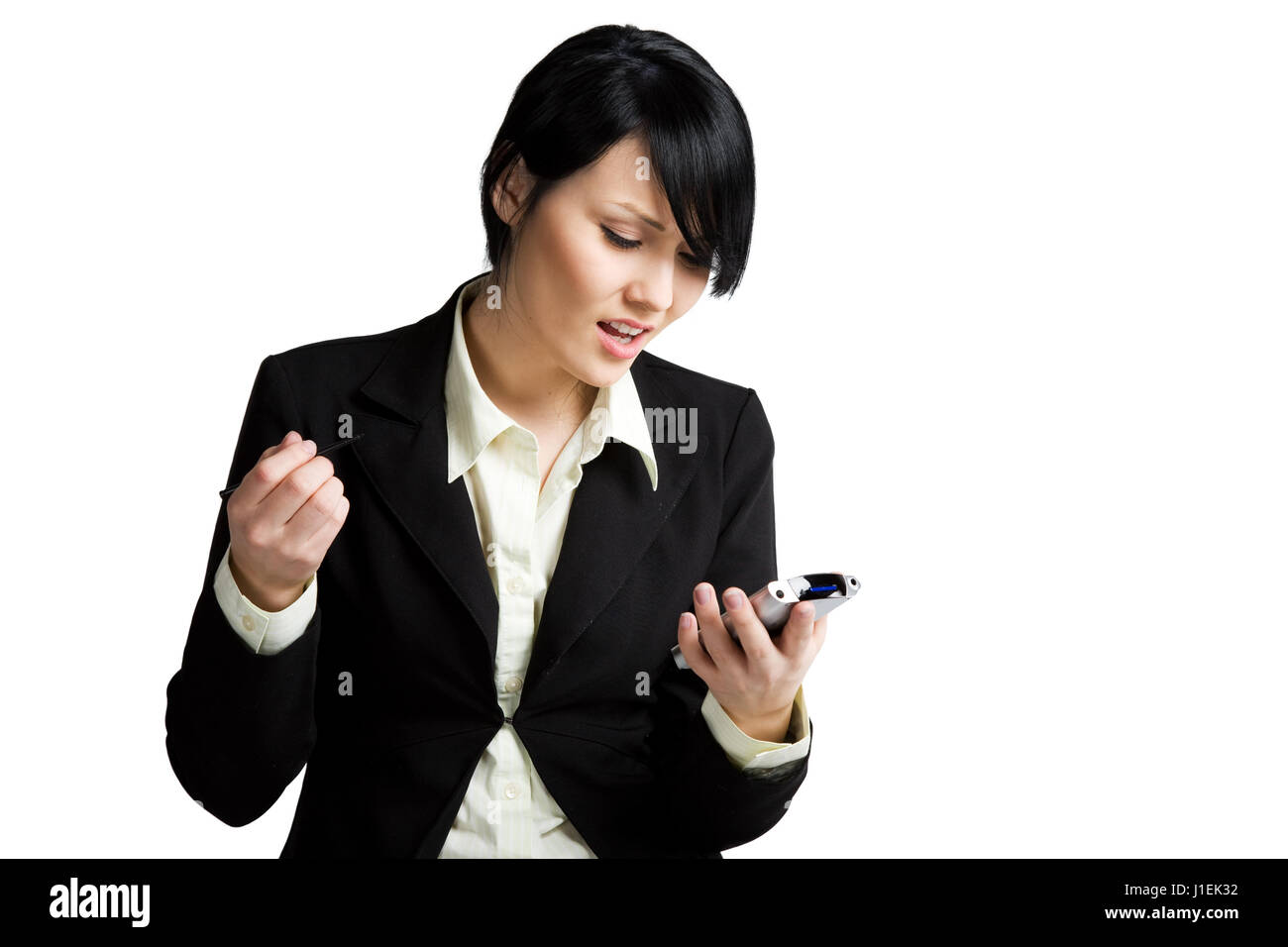 An angry businesswoman working on her PDA Stock Photo - Alamy