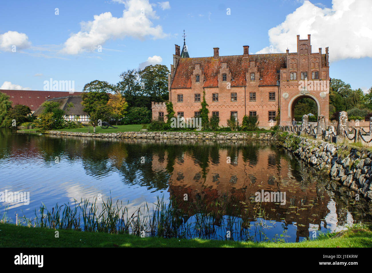 Egeskov castle and reflection in the lake. A castle in Denmark Stock ...
