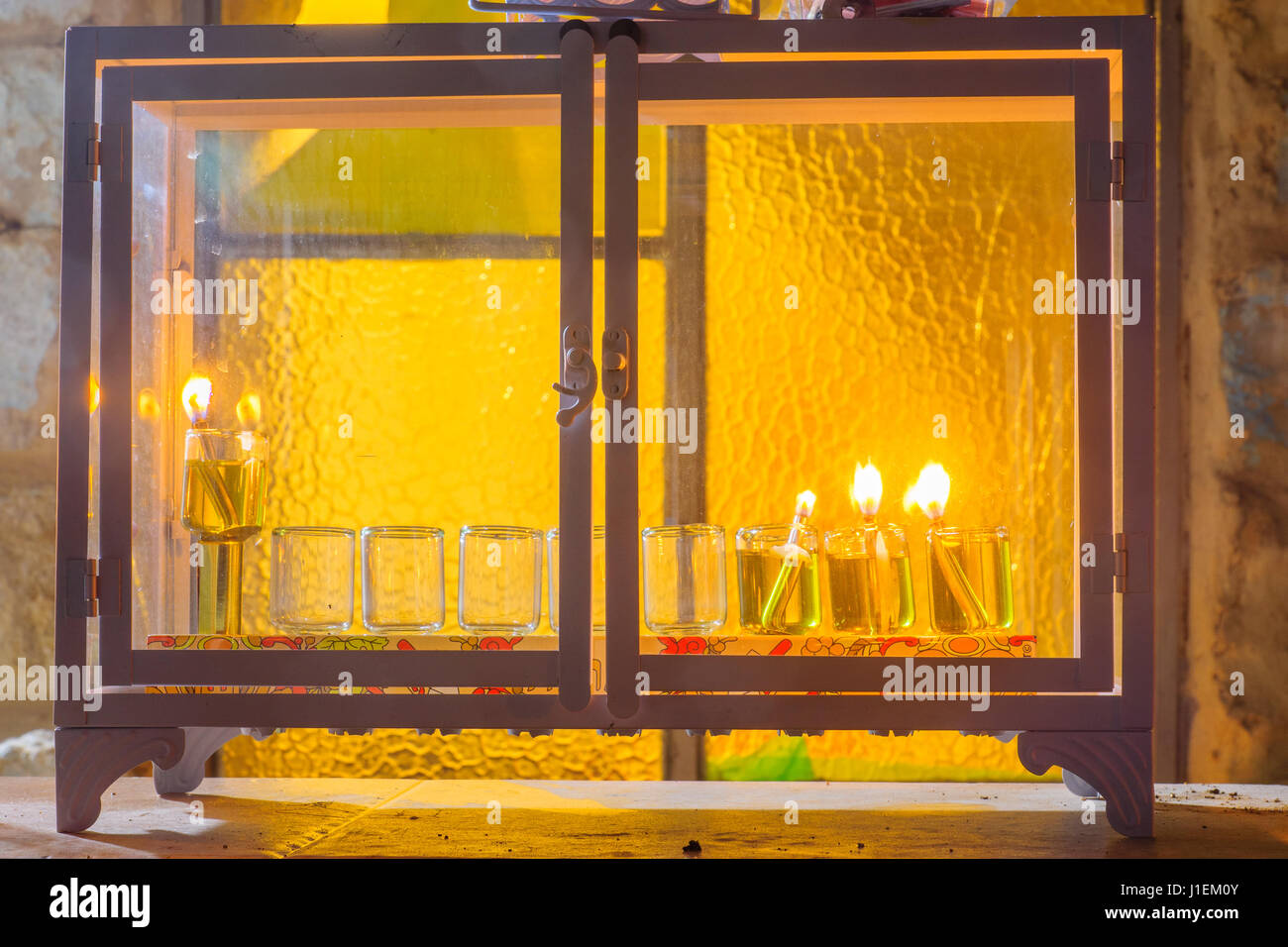 Traditional Menorah (Hanukkah Lamp) with olive oil candles, in the ...