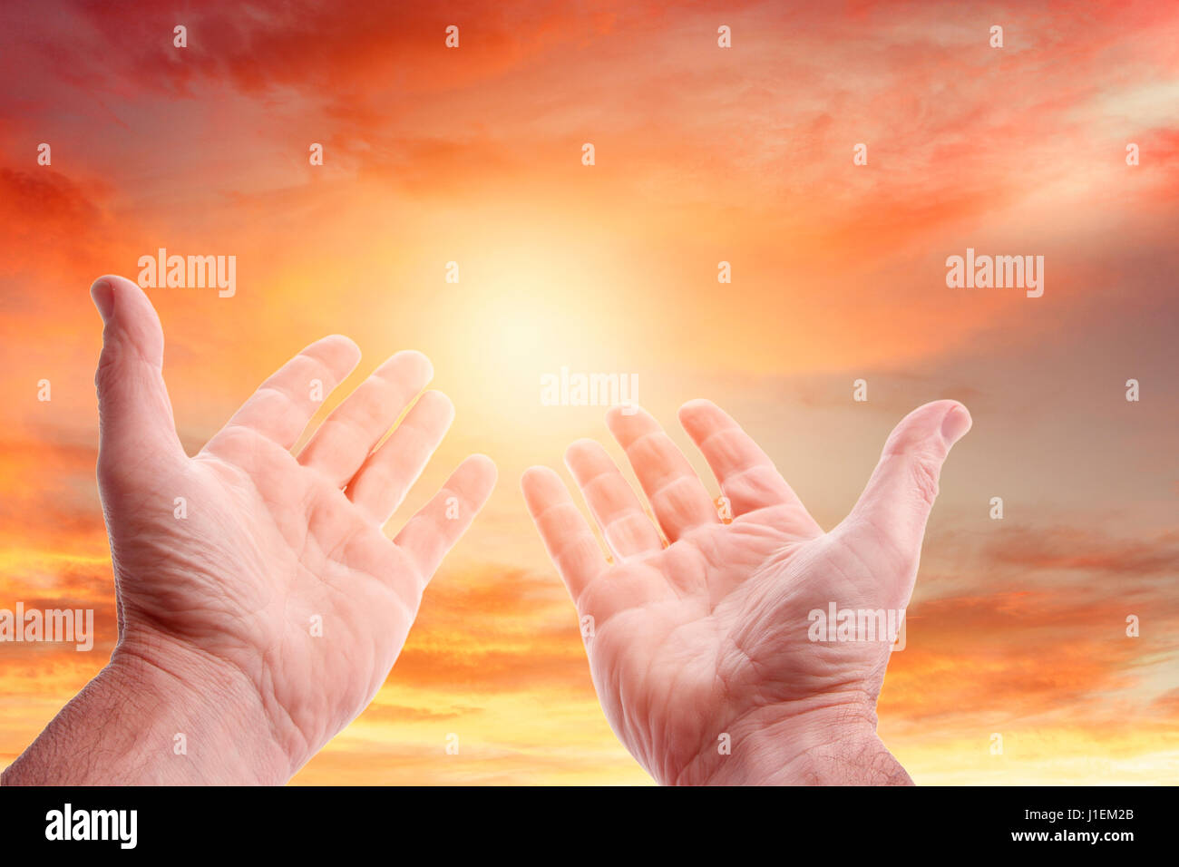 Hands reaching for the sky Stock Photo - Alamy