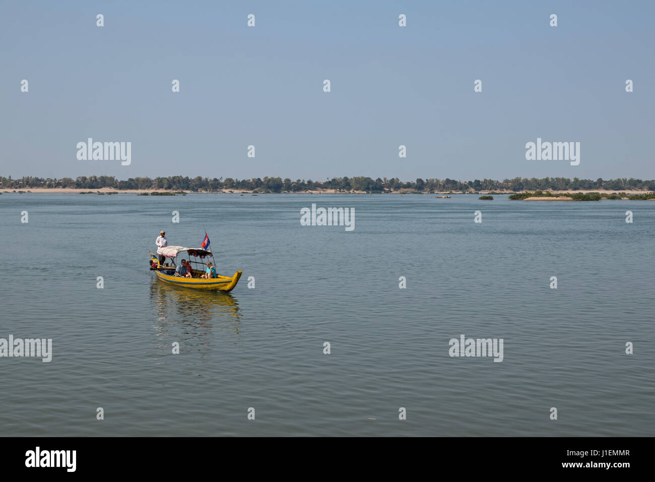 Tourists on a boat trip looking for Irrawaddy dolphin, Mekong River ...