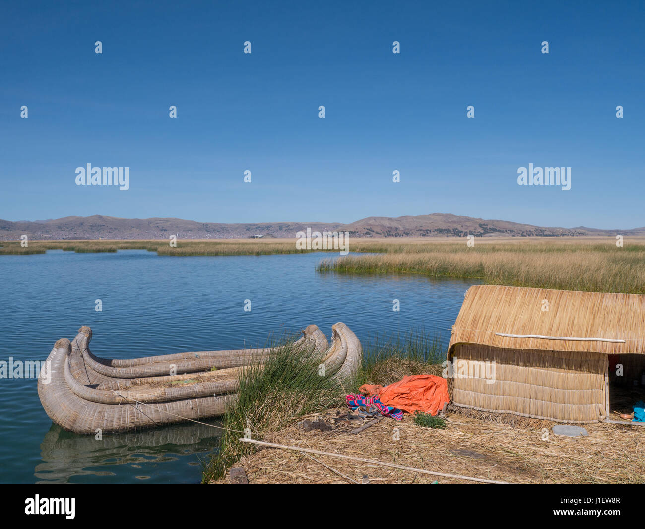 View of the Uros floating reed islands with boats, mysterious Lake ...