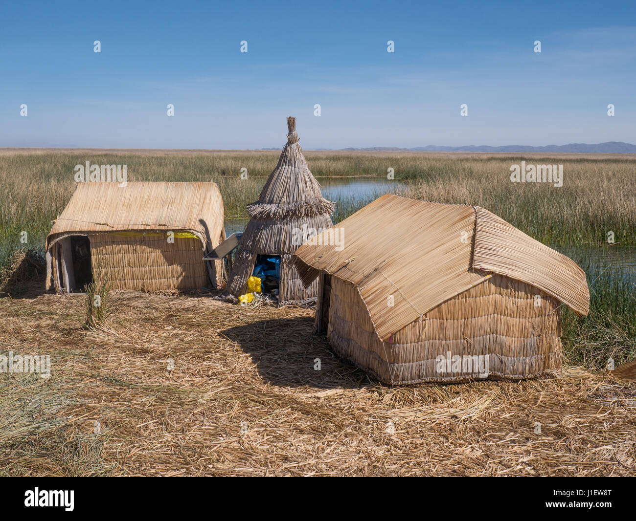 View of the Uros floating reed islands with boats, mysterious Lake ...