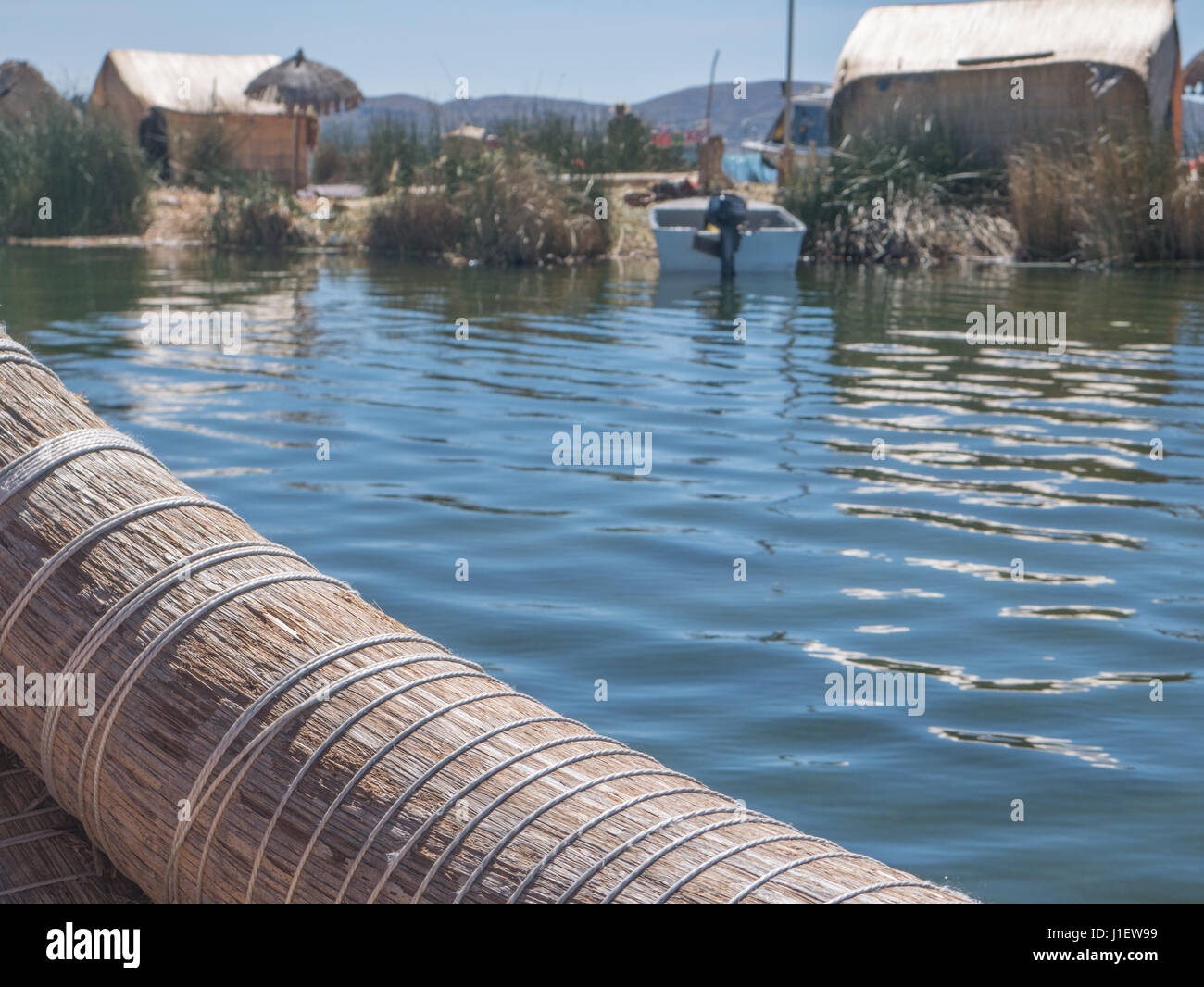 View of the Uros floating reed islands with boats, mysterious Lake ...