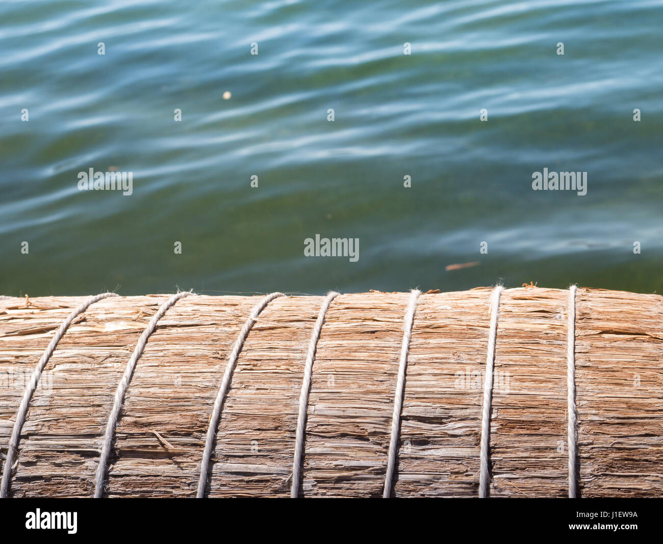 View of the Uros floating reed islands with boats, mysterious Lake ...