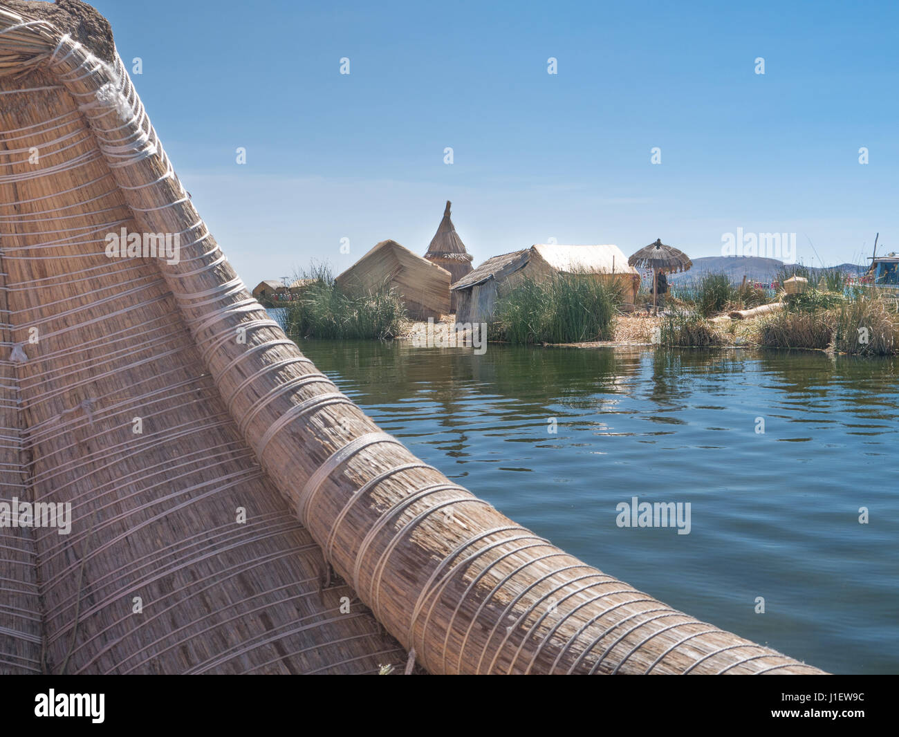 View of the Uros floating reed islands with boats, mysterious Lake ...