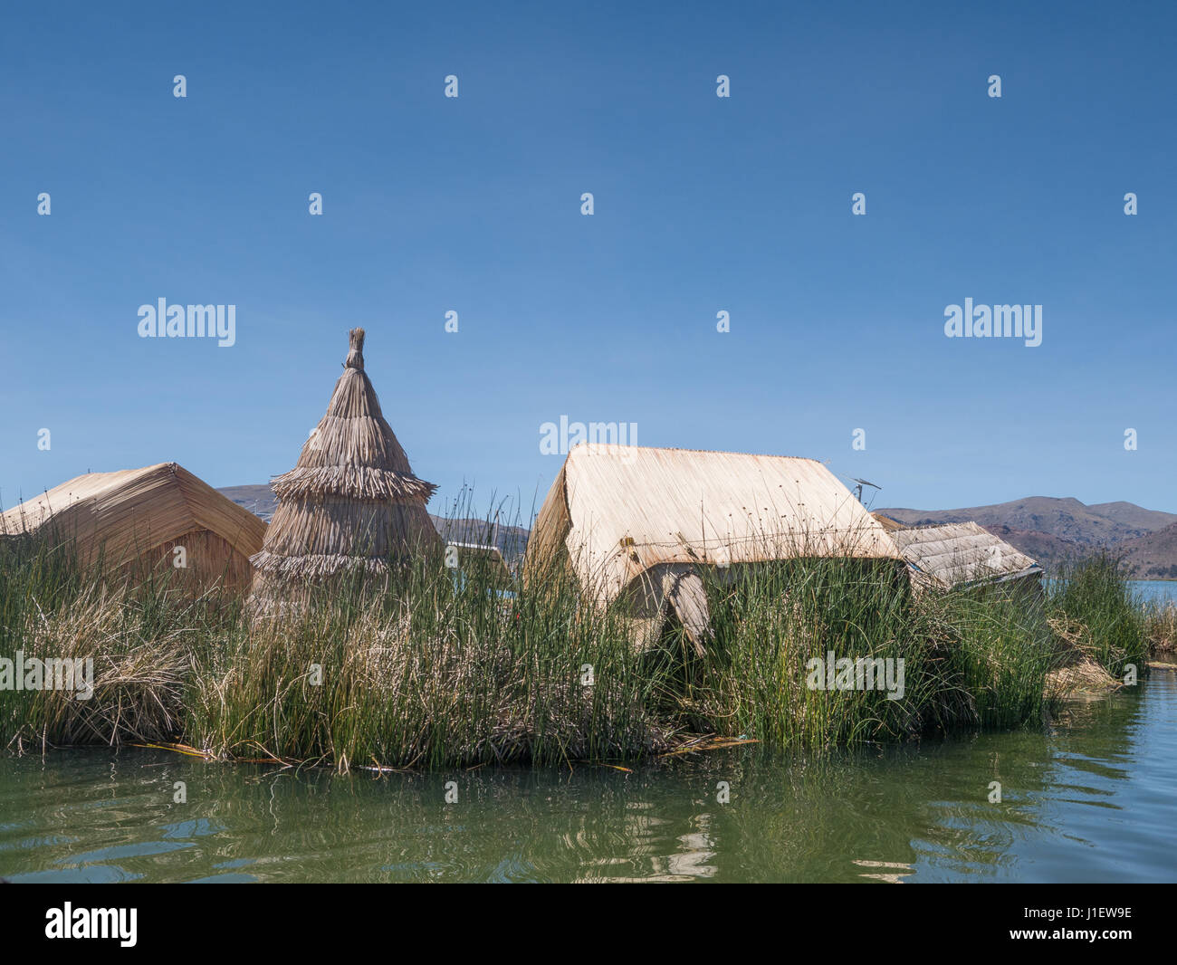 View of the Uros floating reed islands with boats, mysterious Lake ...