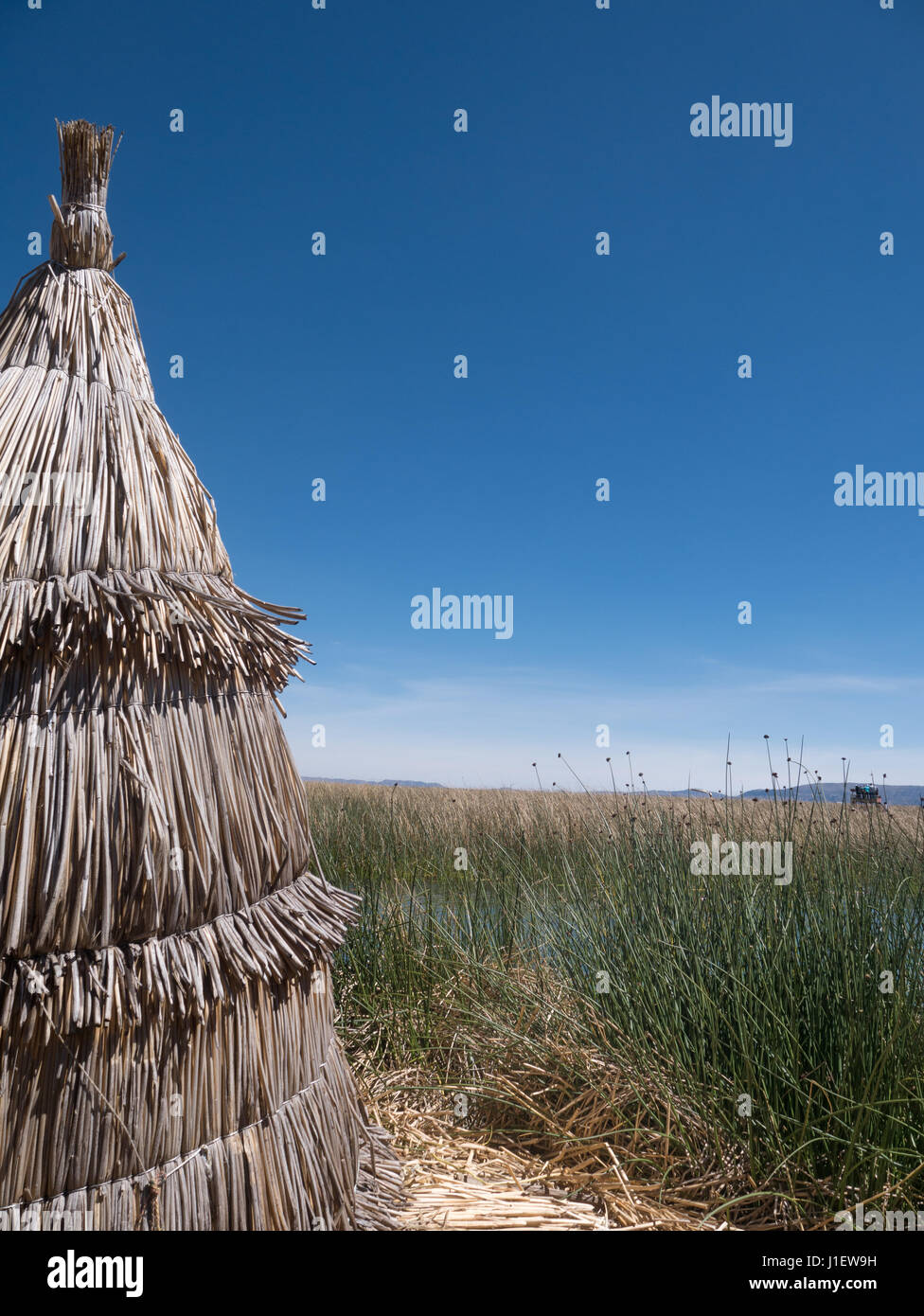 View of the Uros floating reed islands with boats, mysterious Lake ...