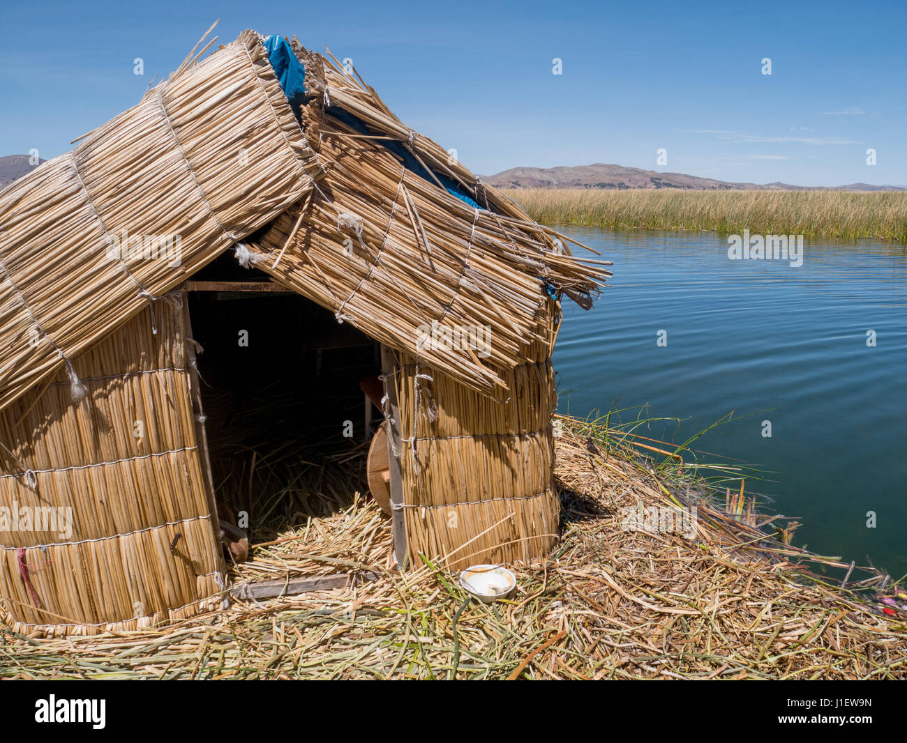 View of the Uros floating reed islands with boats, mysterious Lake ...