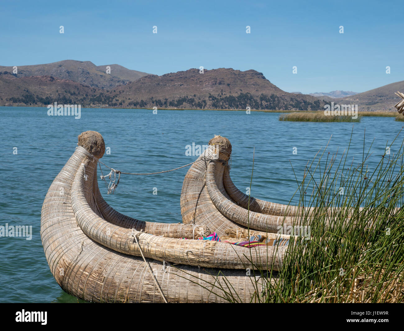 View of the Uros floating reed islands with boats, mysterious Lake ...