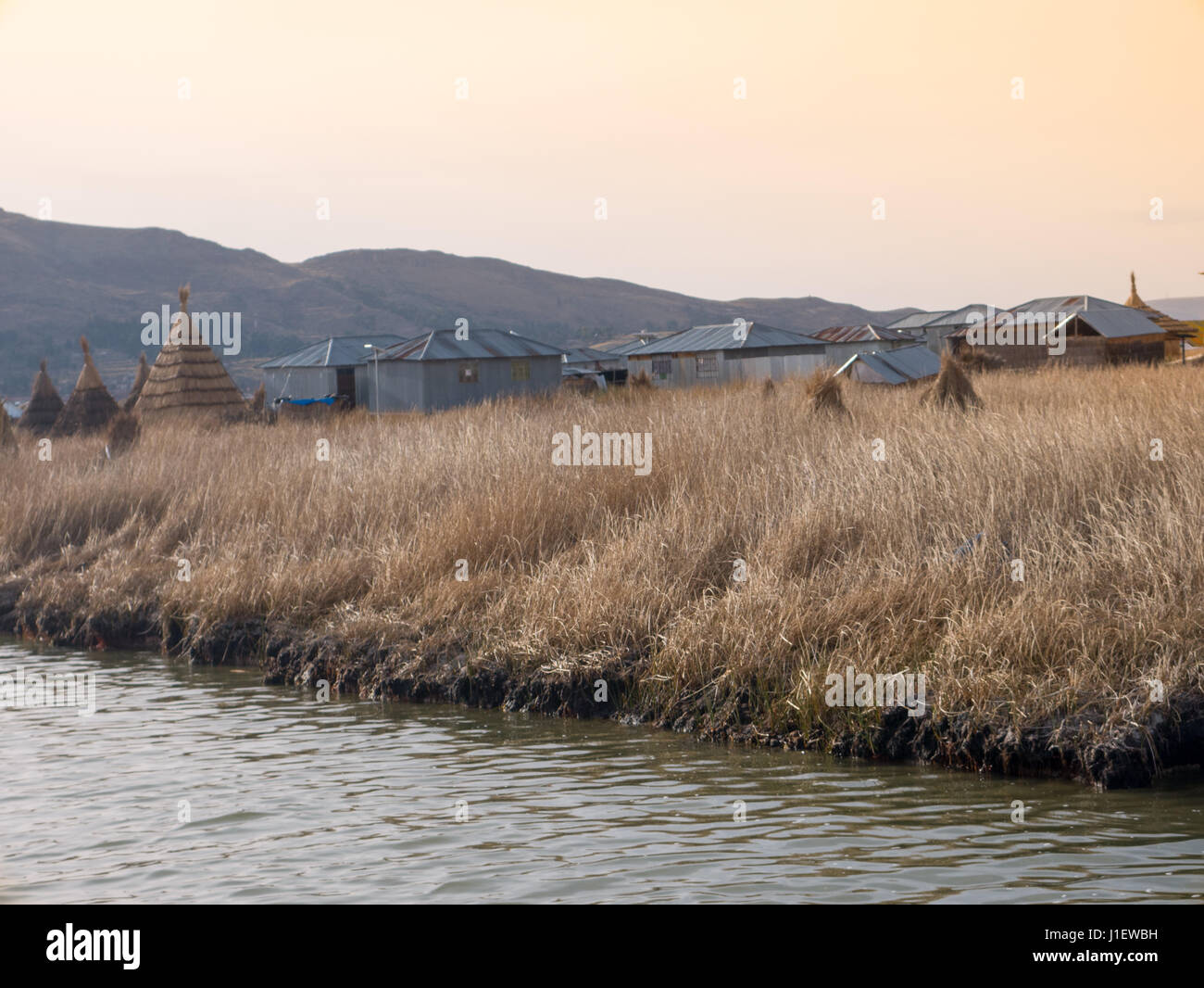 View of the Uros floating reed islands with boats, mysterious Lake ...