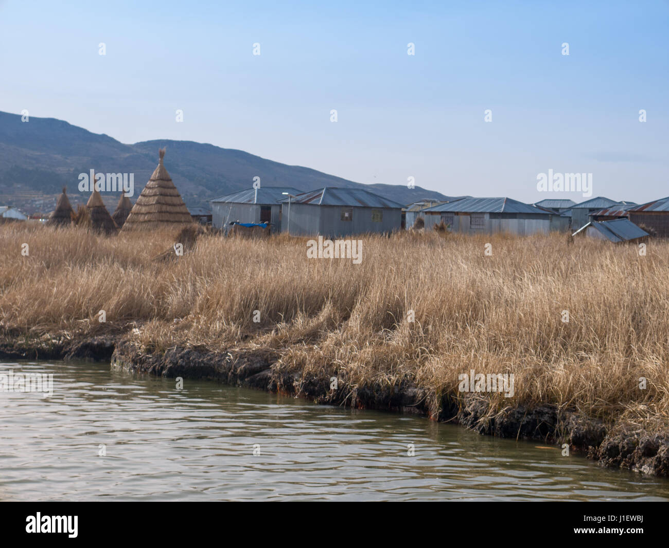 View of the Uros floating reed islands with boats, mysterious Lake ...